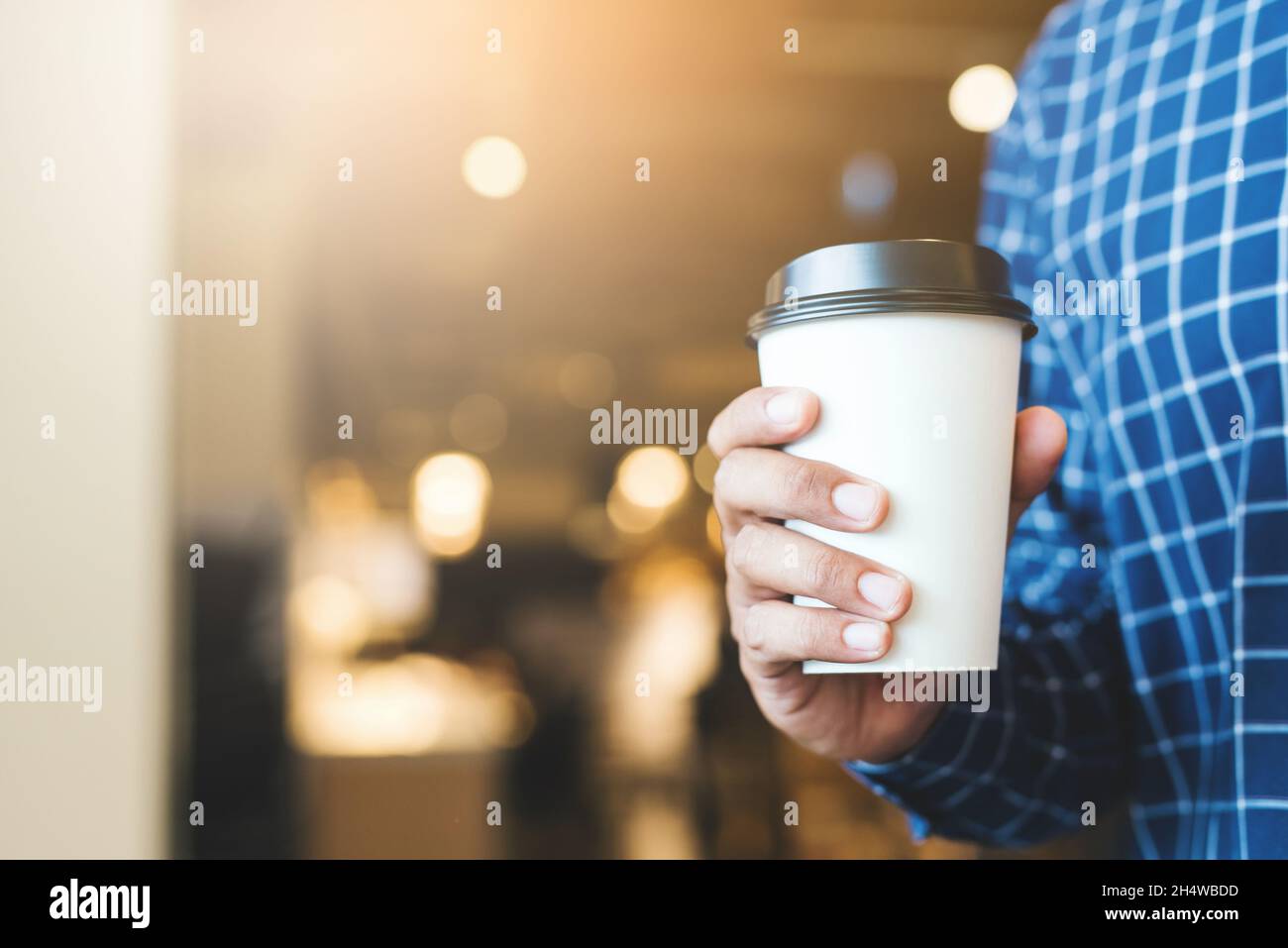 Male hand holding empty cup hi-res stock photography and images - Alamy