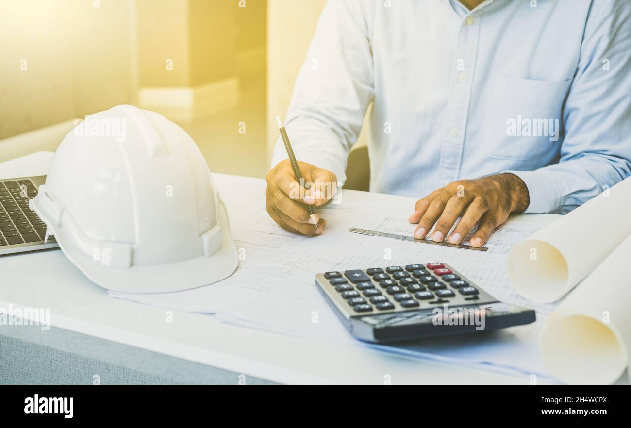 Engineer or architects working planning project on desk Stock Photo - Alamy