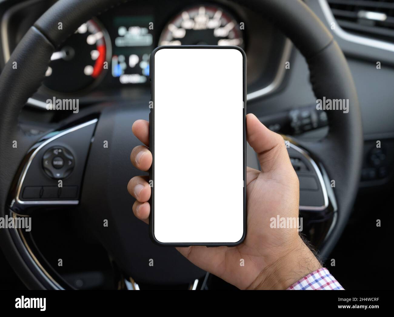 Hand holding blank screen of smartphone while driving car Stock Photo ...