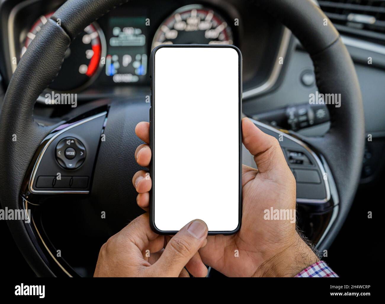 Hand holding blank screen of smartphone while driving car Stock Photo ...