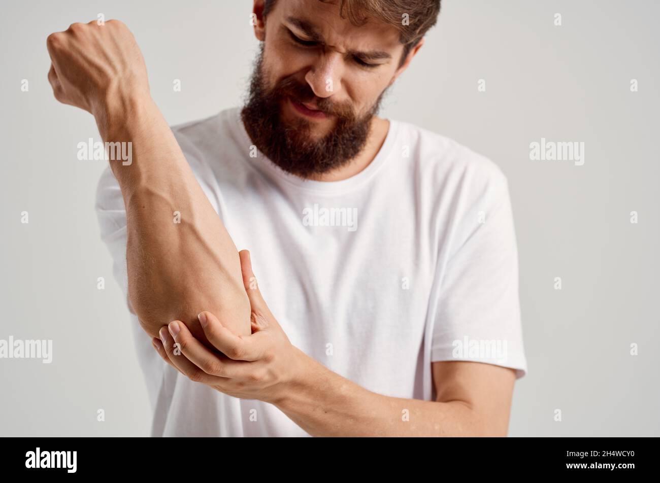 man holding hand pain health problem injury Stock Photo - Alamy