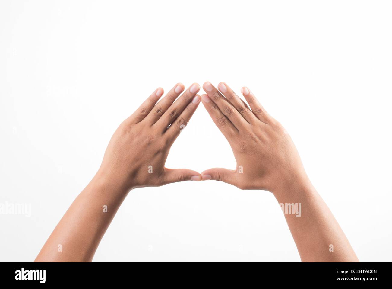 Hands showing the triangle sign Stock Photo - Alamy