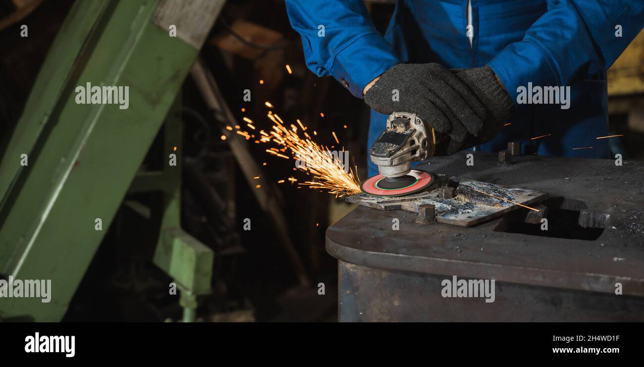 Industrial worker cutting metal and steel with many sparks Stock Photo ...