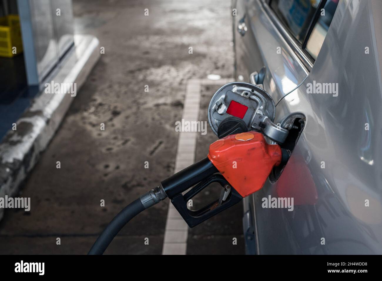 Pumping gasoline fuel in car at gas station Stock Photo - Alamy