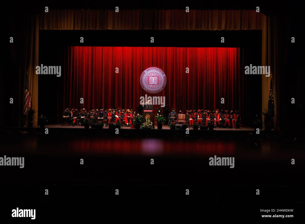 Indiana governor Eric Holcomb (C) speaks before Pamela Whitten (next to ...