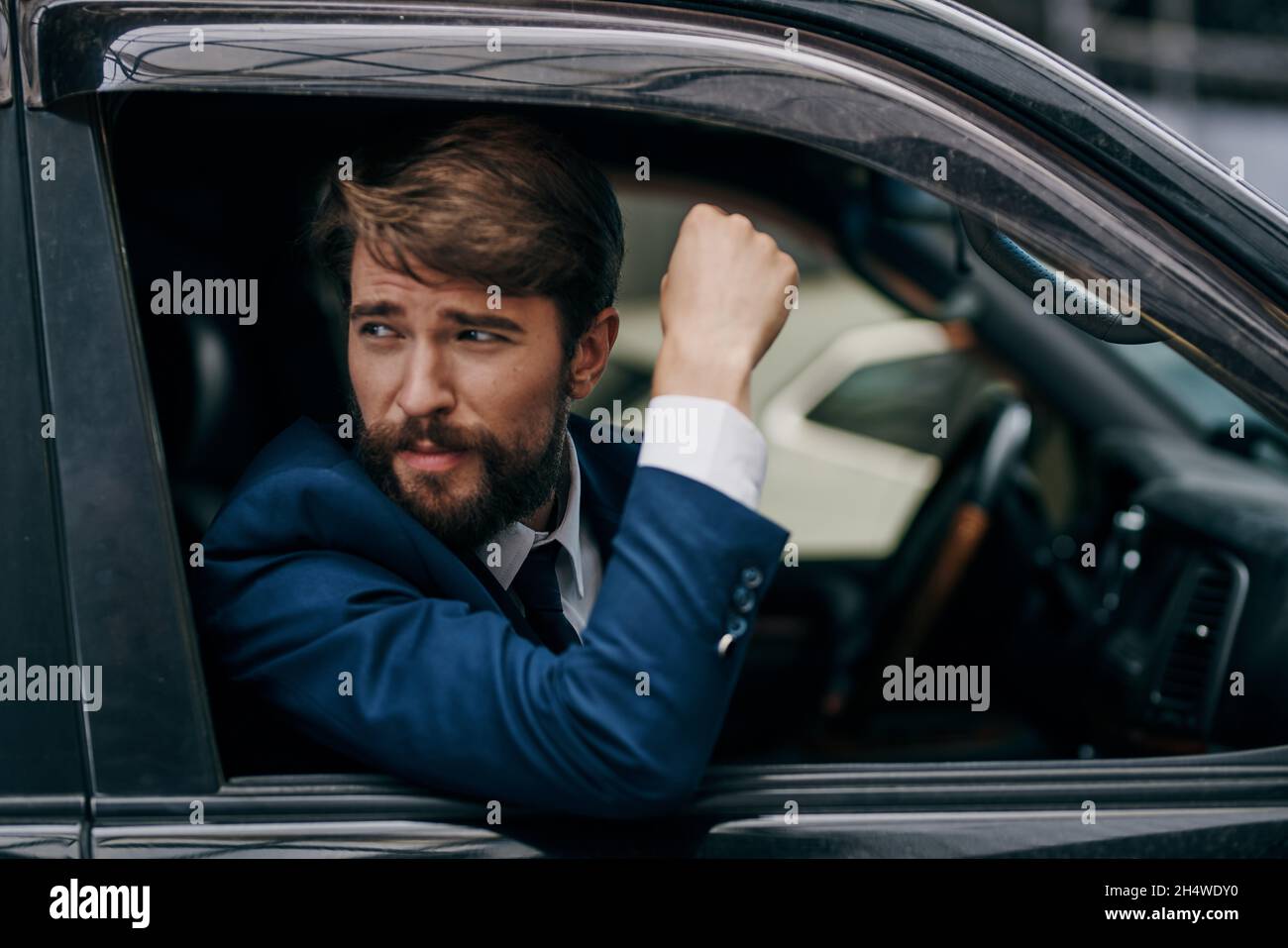 business man driving a car trip service Stock Photo - Alamy