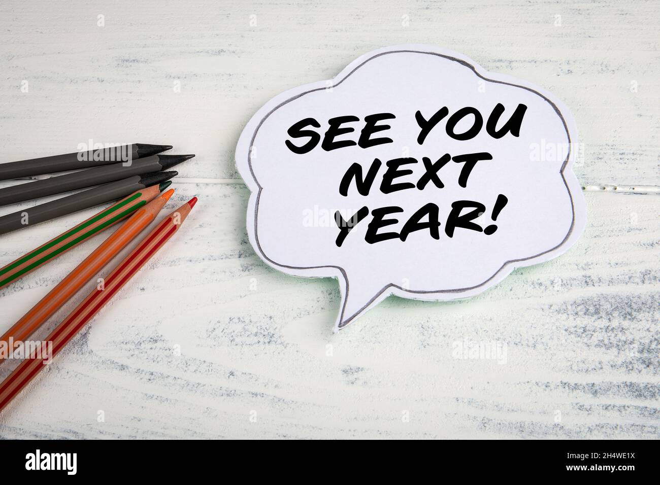 See You Next Year. Speech bubble on wooden table Stock Photo - Alamy