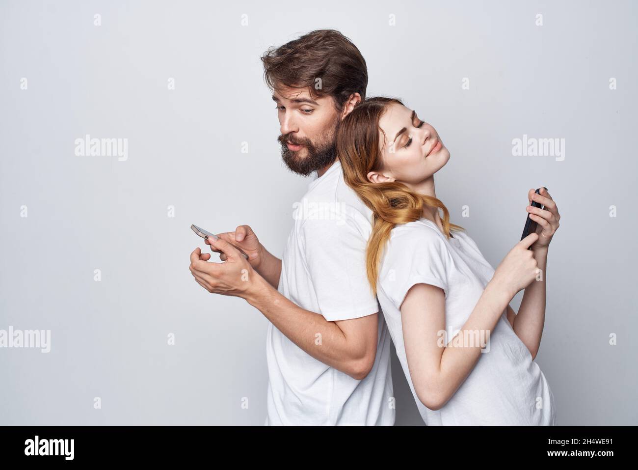 man and woman quarrel jealousy telephones communication light ...