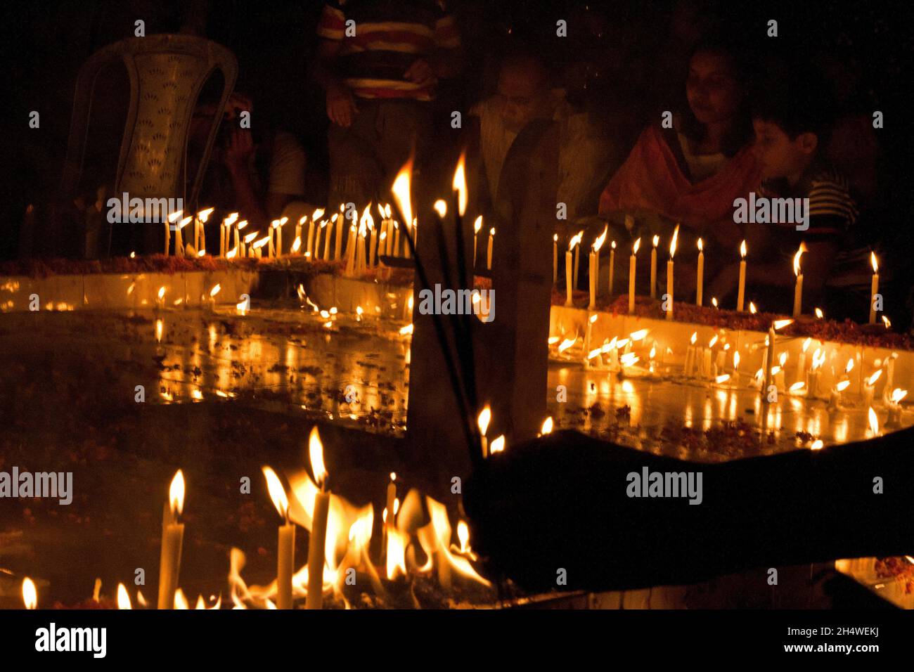 Dhaka, Bangladesh. 04th Nov, 2021. Devotees seen lighting candles as ...