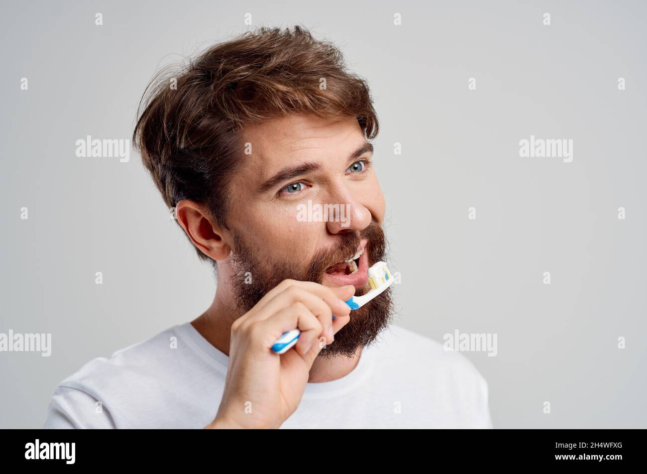 emotional man toothbrush in hand hygiene clean teeth isolated ...