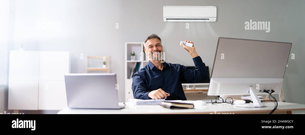 Air Conditioner Remote Control. Room AC In Modern Office Stock Photo ...