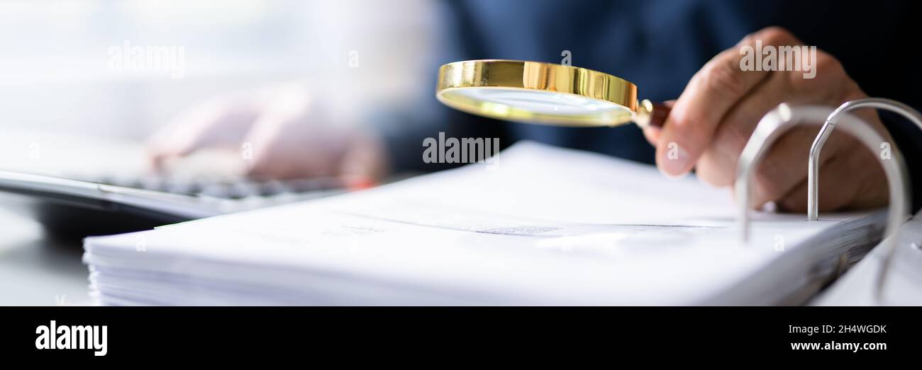Auditor Using Magnifying Glass For Audit And Fraud Investigation Stock ...