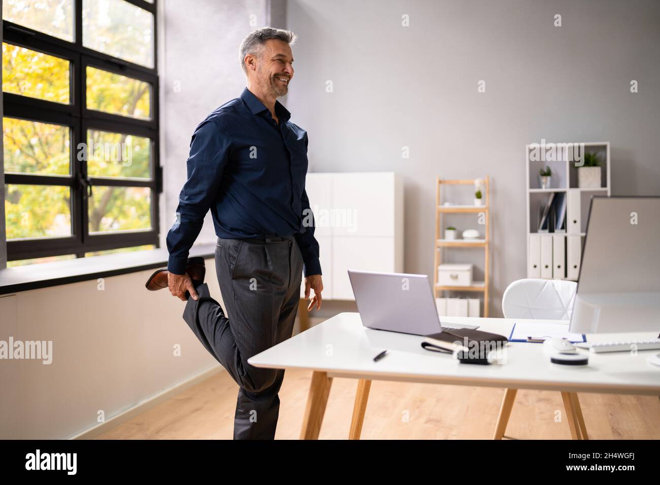 Standing Office Yoga Workout And Workout Near Business Computer Stock ...