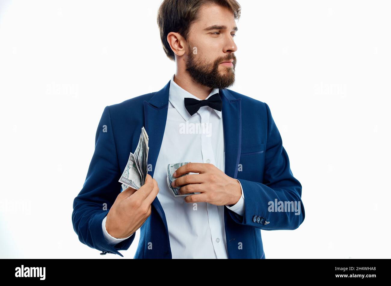 rich man dollars millionaire light background Stock Photo - Alamy