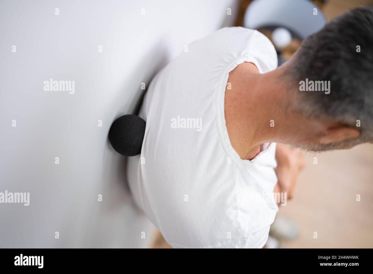 Back Trigger Point Massage Using Foam Ball Myofascial Release Stock ...