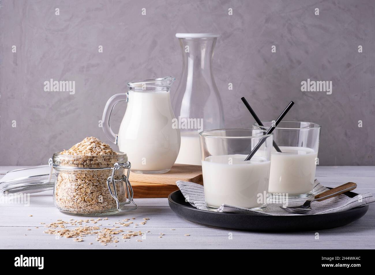 Various glass serving vessels with oat milk and oatmeal container Stock ...