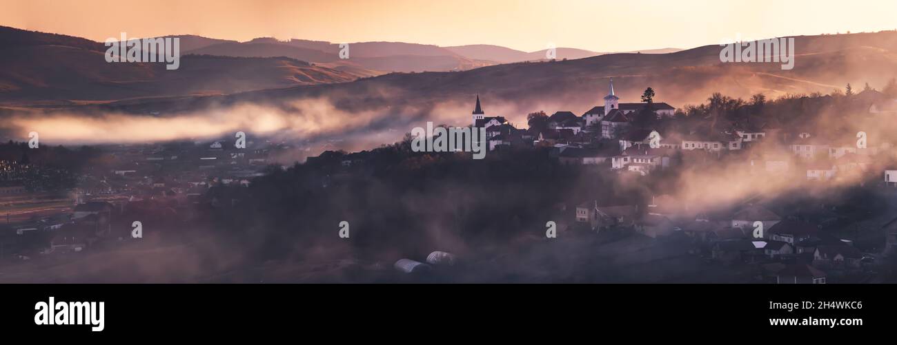 Aerial view of small village in magic sunset, Sic, Transylvania ...