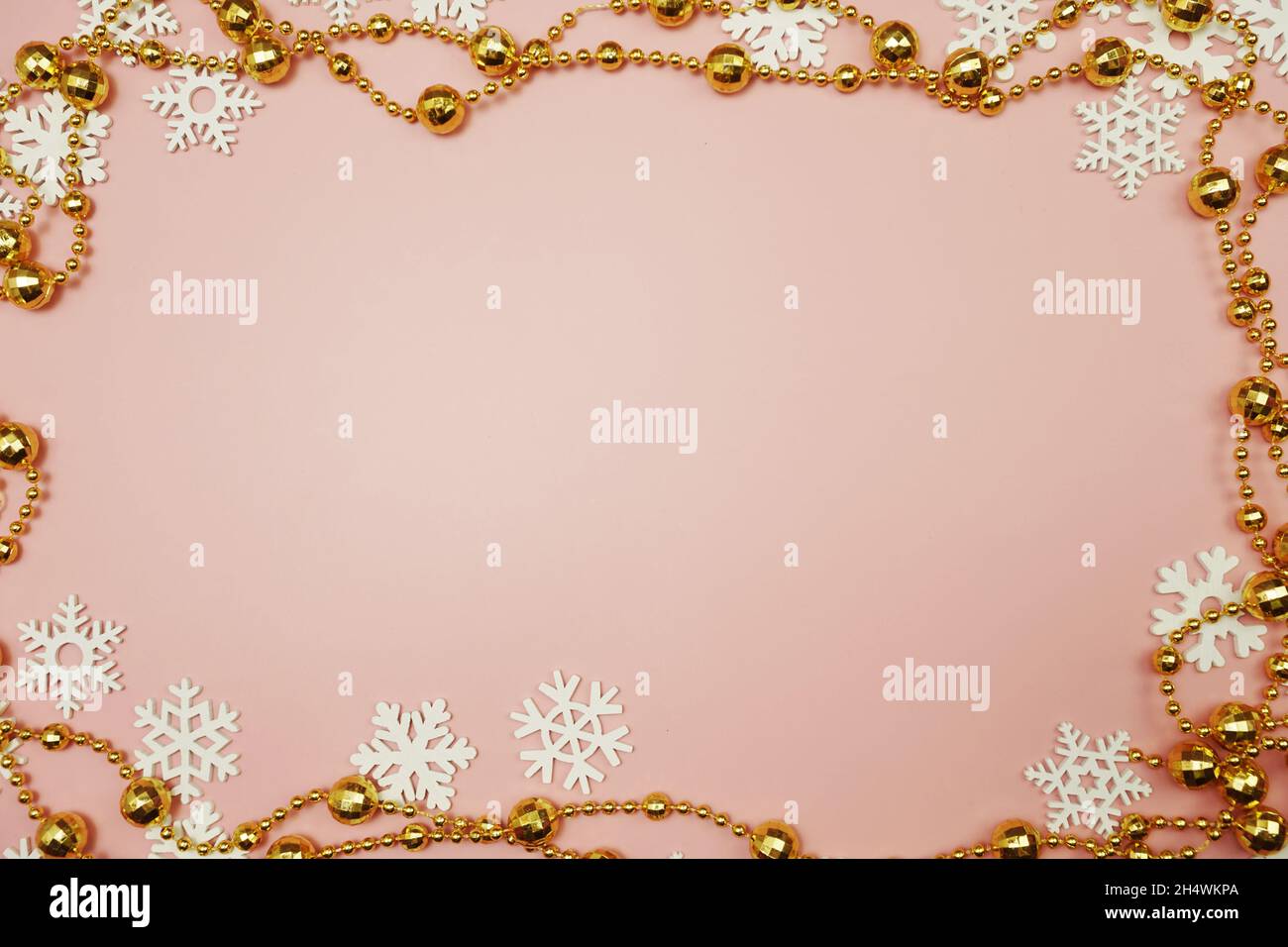 Christmas Ornament border frame on pink background Stock Photo - Alamy