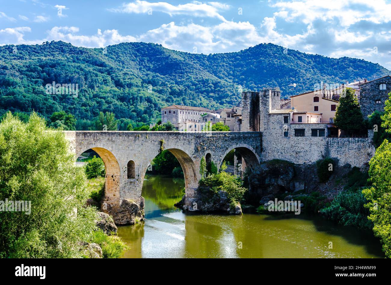 Famous medieval bridge over the river Fluvia in the medieval village de ...