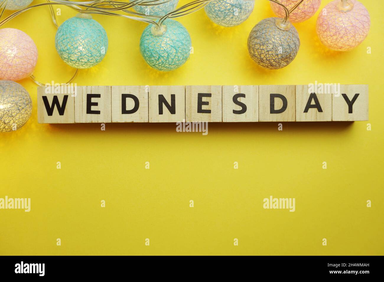 Wednesday alphabet letter with LED Cotton ball Decoration on yellow ...
