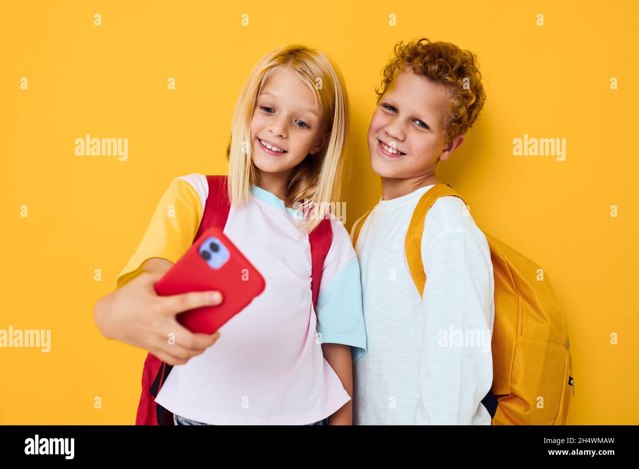 cute kids looking at the phone entertainment communication Stock Photo ...
