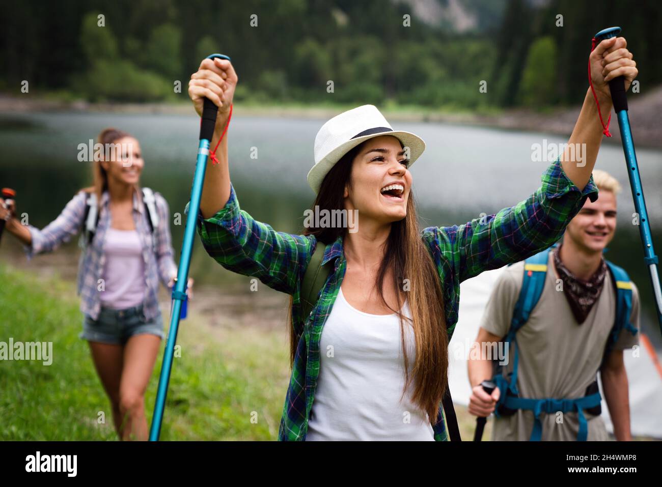 Group of happy hiker friends trekking as part of healthy lifestyle ...