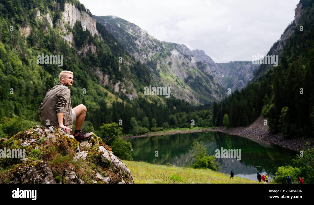 Happy hiker winning reaching life goal, success, freedom and happiness ...