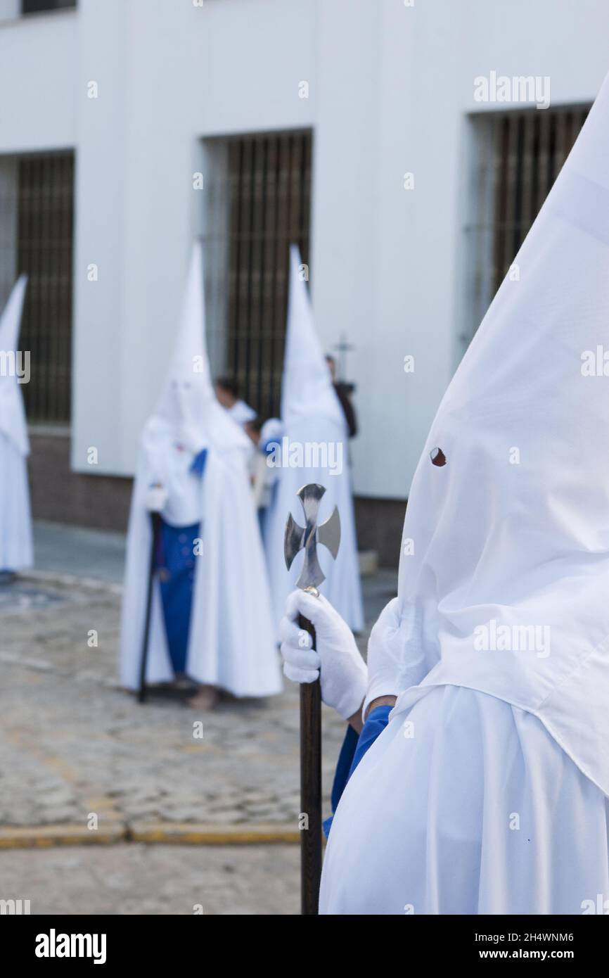 Vertical shot of people dressed as Ku Klux Clan members at the Holy ...