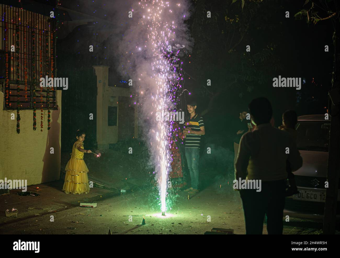 Family playing with firecrackers hi-res stock photography and images ...