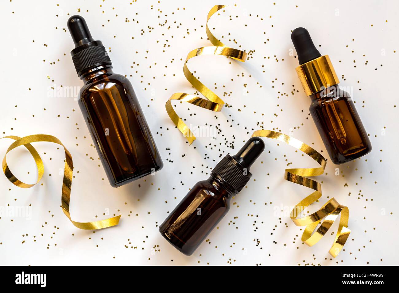 Amber glass essential oil brown bottles with golsen streamers and ...