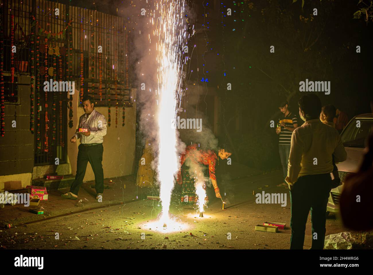 Family playing with firecrackers hi-res stock photography and images ...