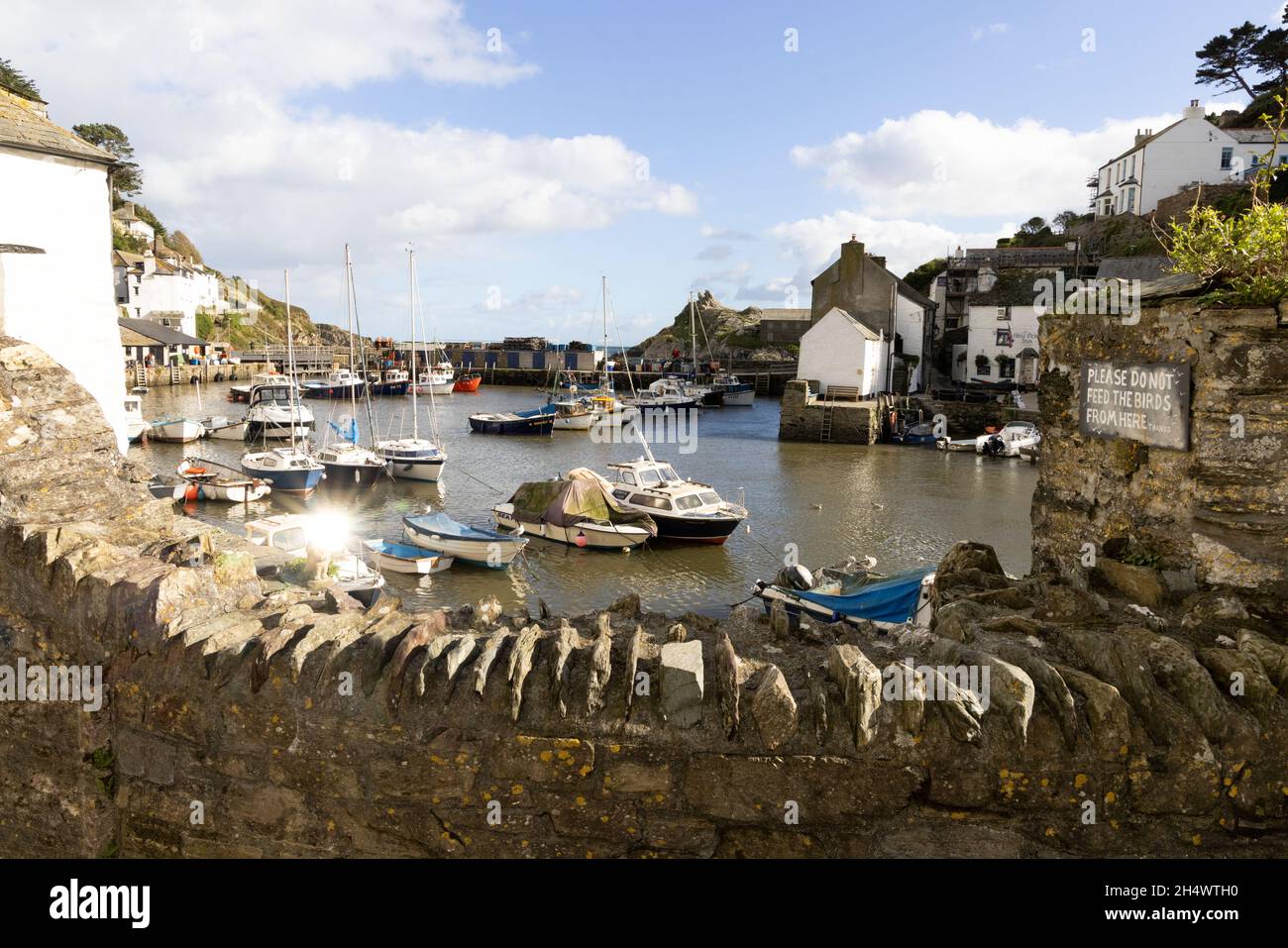 Cornwall summer, Polperro UK; fishing boats in Polperro harbour, in the ...