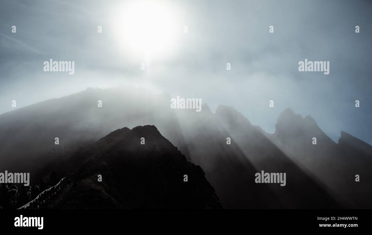 Mist over mountain peaks in Auvergne Stock Photo - Alamy