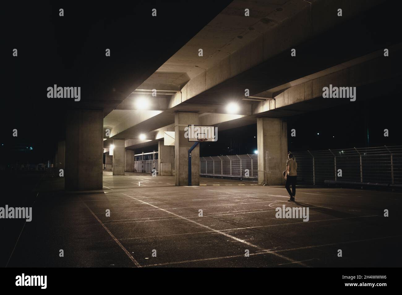 Street basketball player under a bridge in Toulouse at night Stock ...