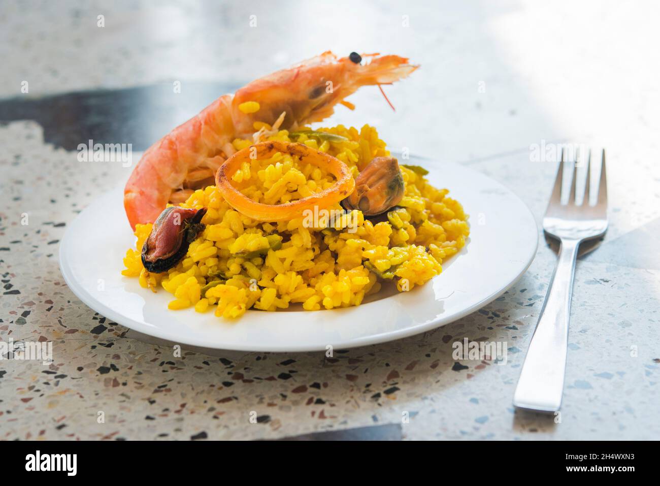 Paella typical spanish food in granite background Stock Photo - Alamy