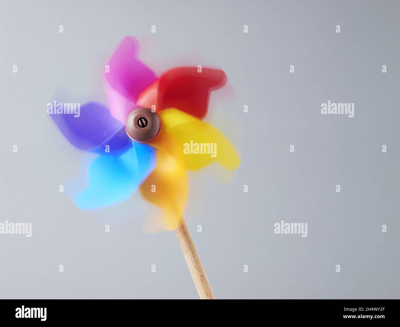 Closeup of a colorful toy fan on a white background Stock Photo - Alamy