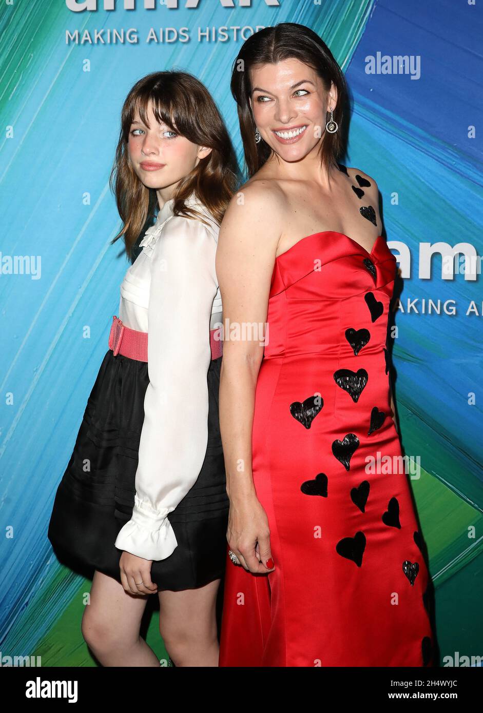Ever Gabo Anderson and Milla Jovovich at the amfAR Gala Los Angeles ...