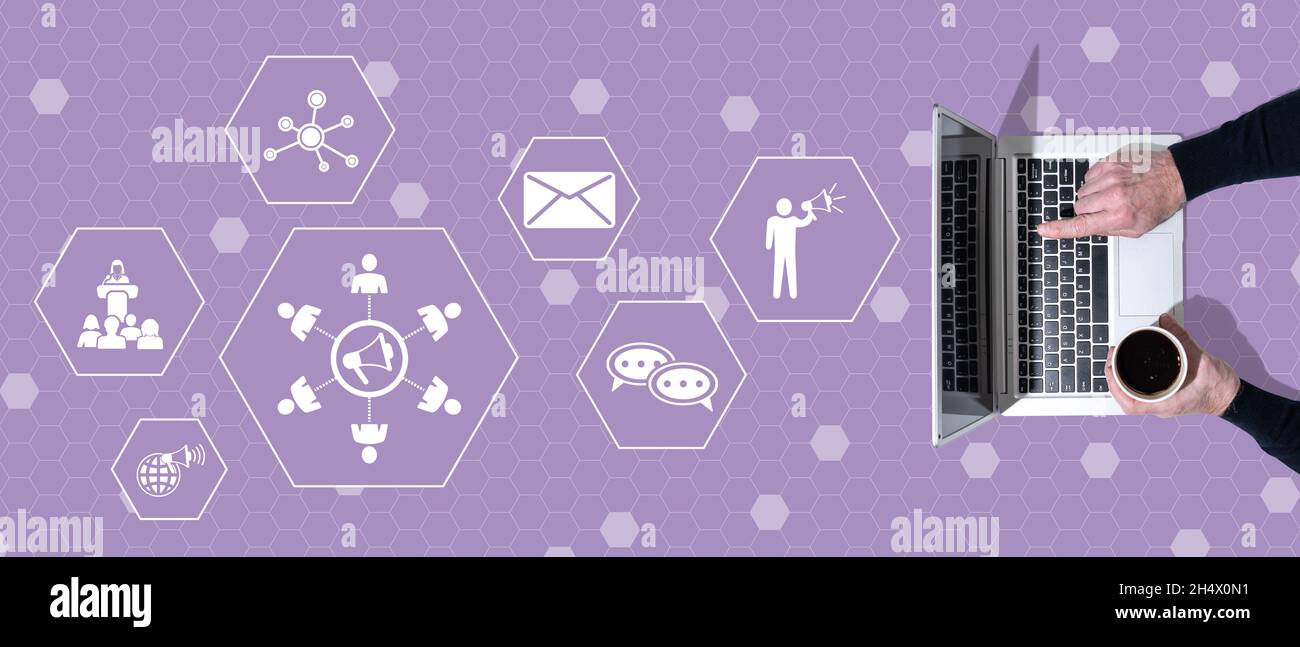 Top view of hands using laptop with symbol of public relations concept ...