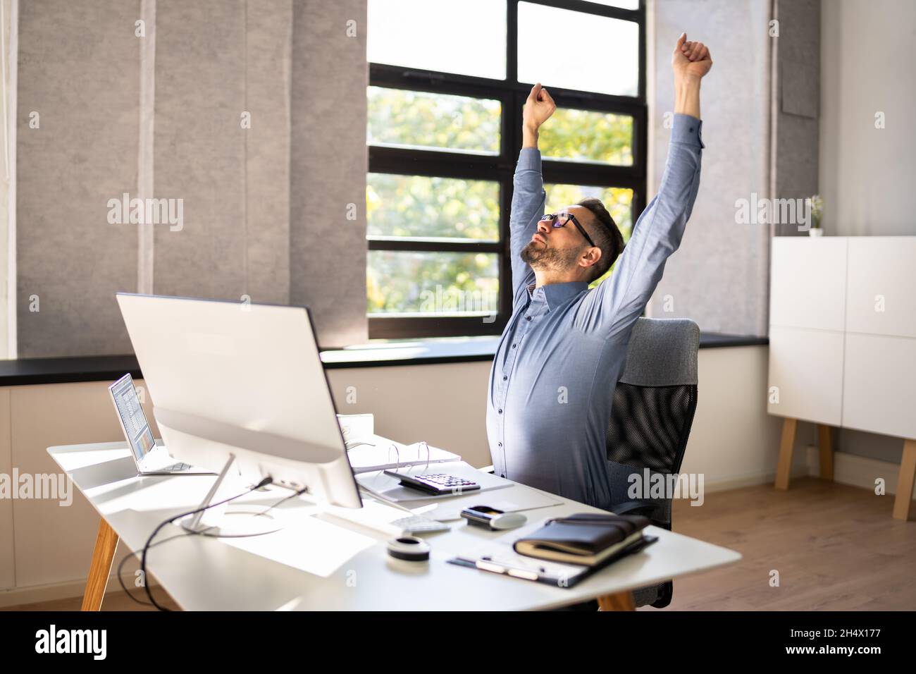 Stretch Exercise Workout At Office Business Desk Stock Photo - Alamy