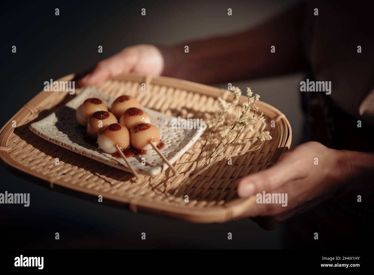 Roasted Mitarashi Dango in the wooden tray, one of the most popular ...