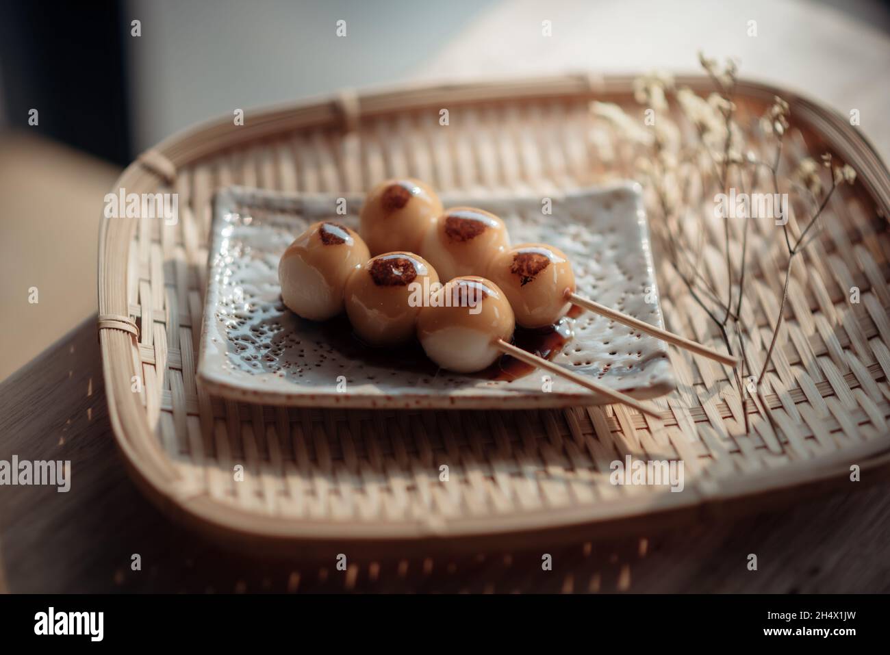 Roasted Mitarashi Dango in the wooden tray, one of the most popular ...