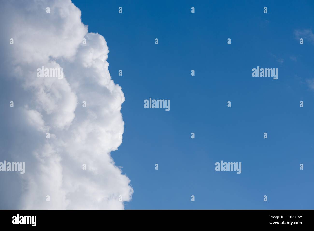 Fluffy white cloud on deep blue sky, border with copy-space Stock Photo ...