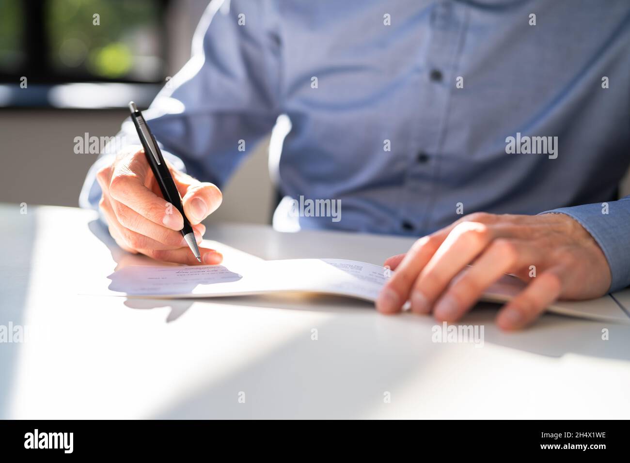 Insurance Paycheck. Payroll Check. Hand Writing Cheque Stock Photo - Alamy