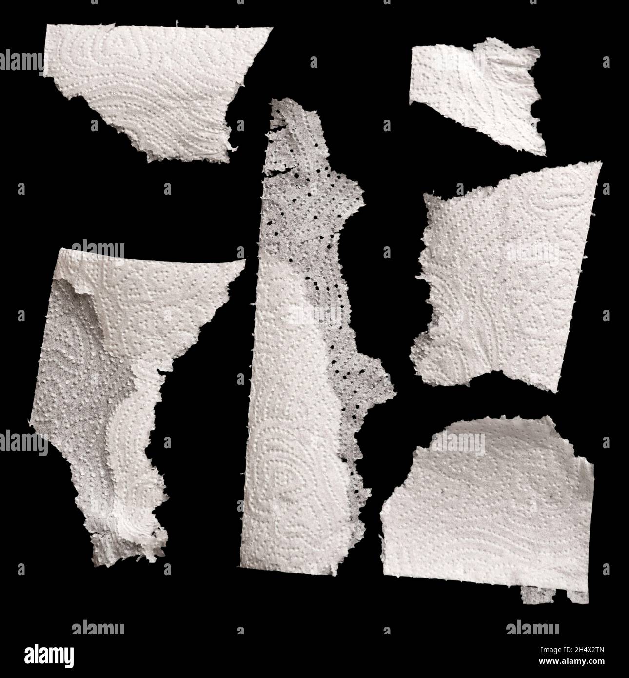 White torn napkin on black background Stock Photo - Alamy