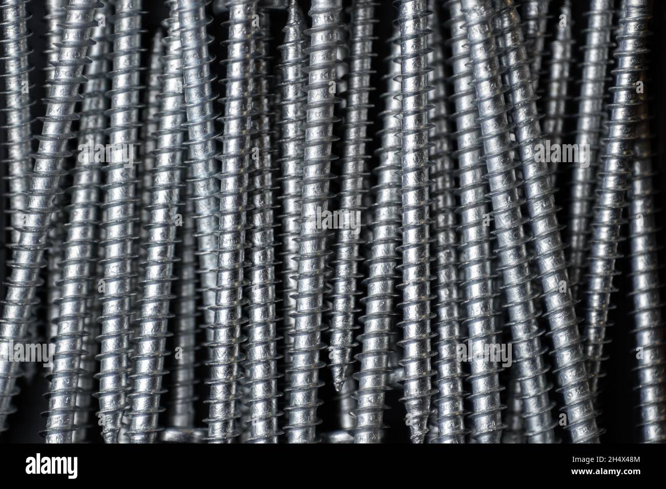 Pile of screws made of steel as a background Stock Photo - Alamy