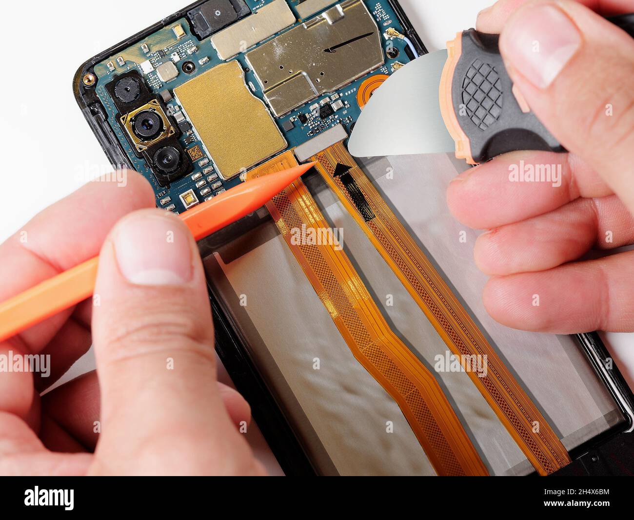 Close up hands of technician repairing smartphone do it yourself ...