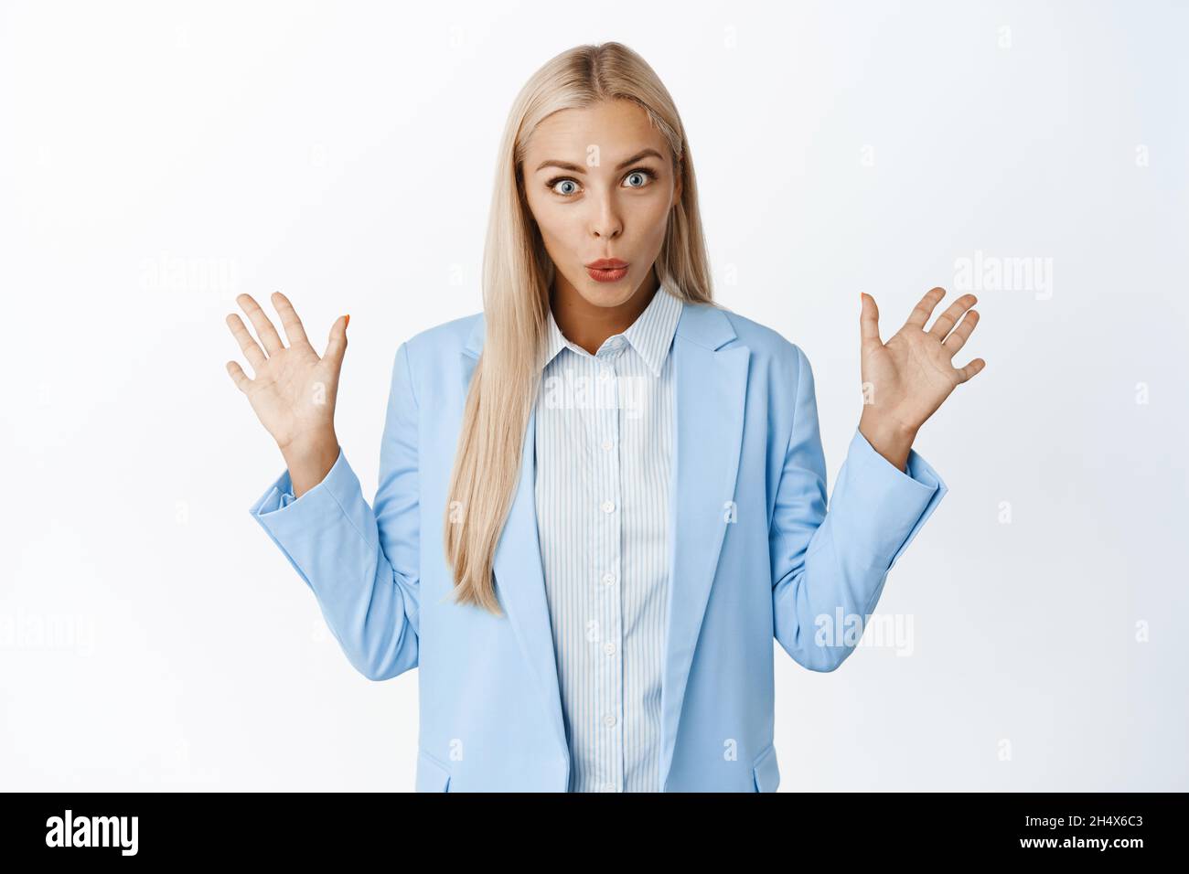 Image of surprised business woman drop something, raising empty hands ...