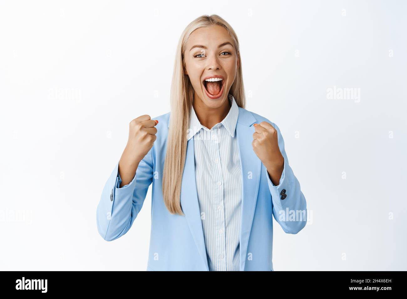 Enthusiastic corporate woman cheering, chanting and encouraging team ...
