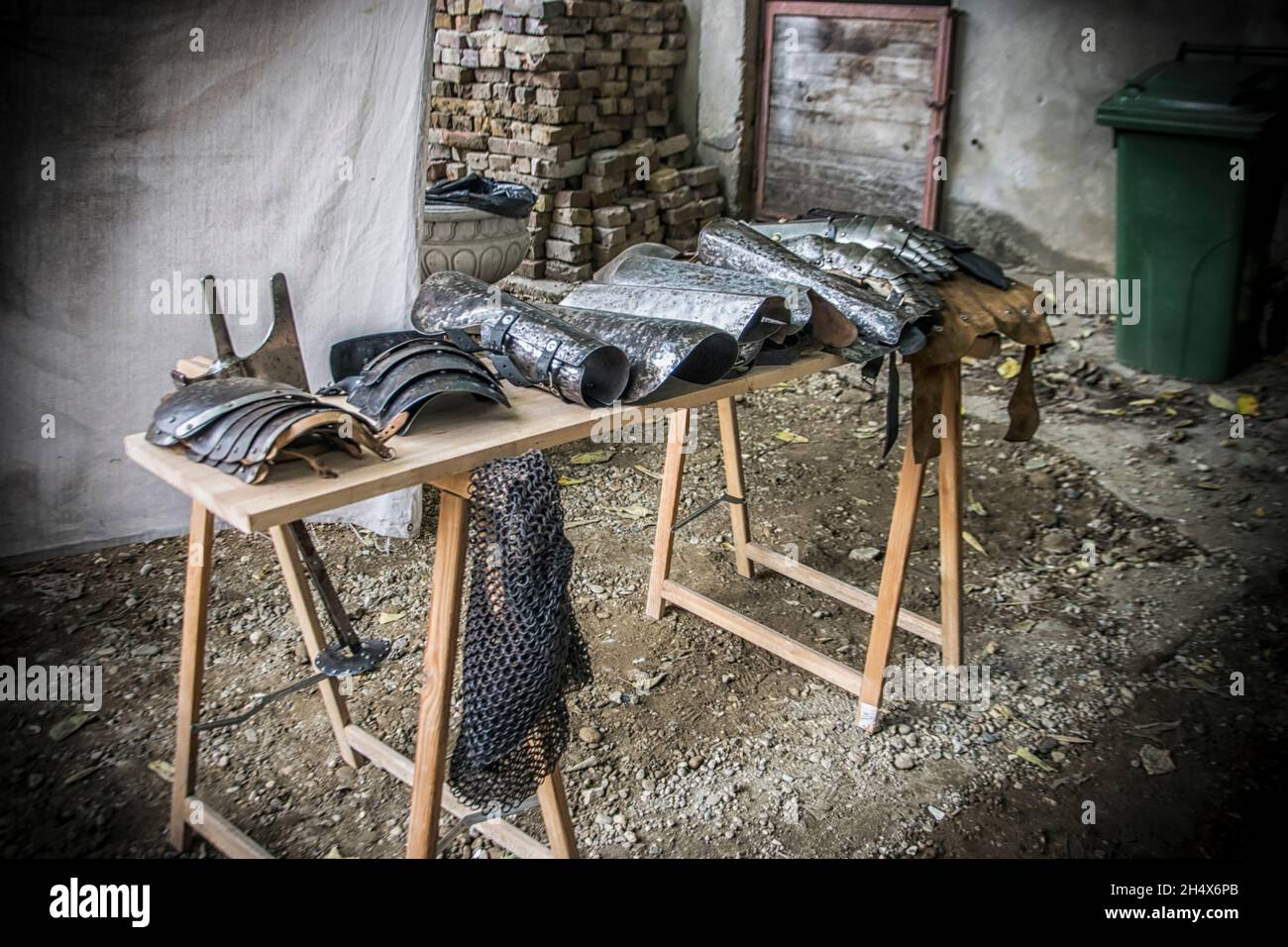 A line-up of retro plate armour pieces on a table Stock Photo - Alamy