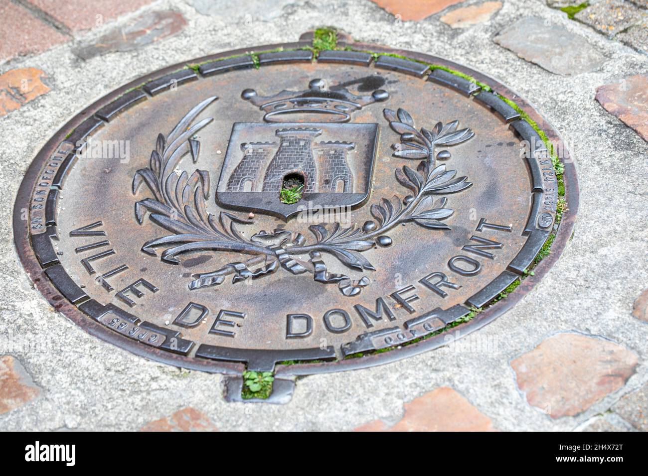manhole cover in france domfront Stock Photo - Alamy